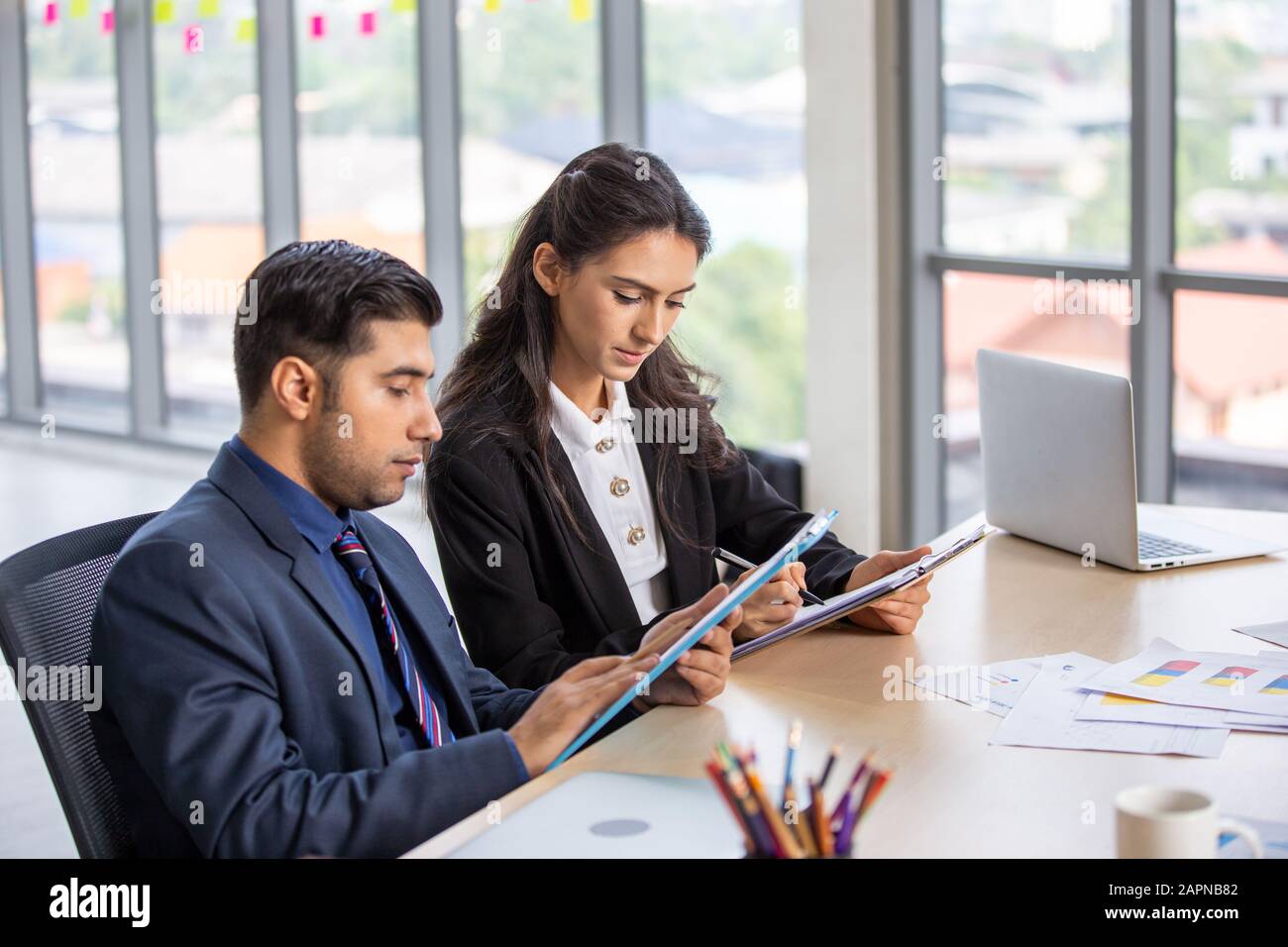 young business team working together at office. Manager pointing at a ...