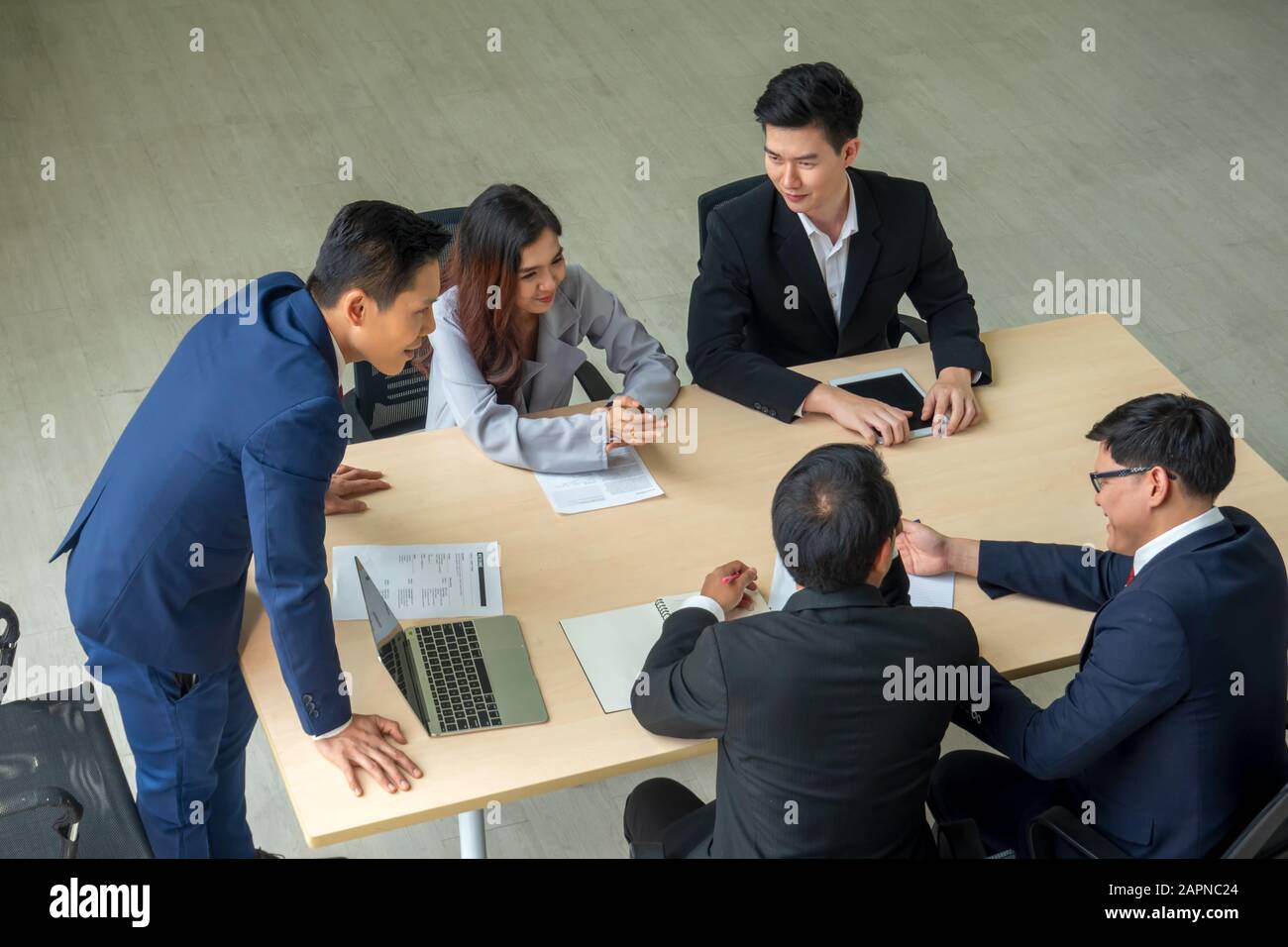 young business team working together at office. Manager pointing at a ...
