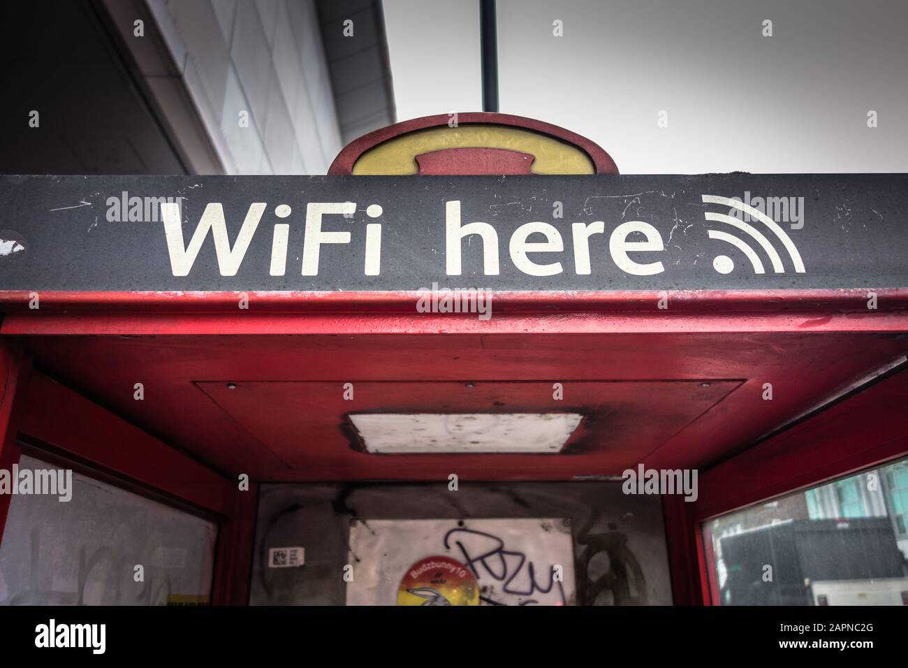 Closeup of WiFi here signage on a phonebox in Finchley, North London ...