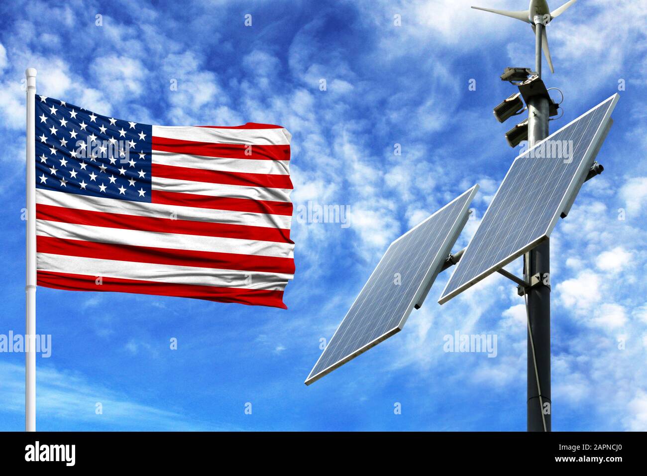 Solar panels on a background of blue sky with a flagpole and the flag ...
