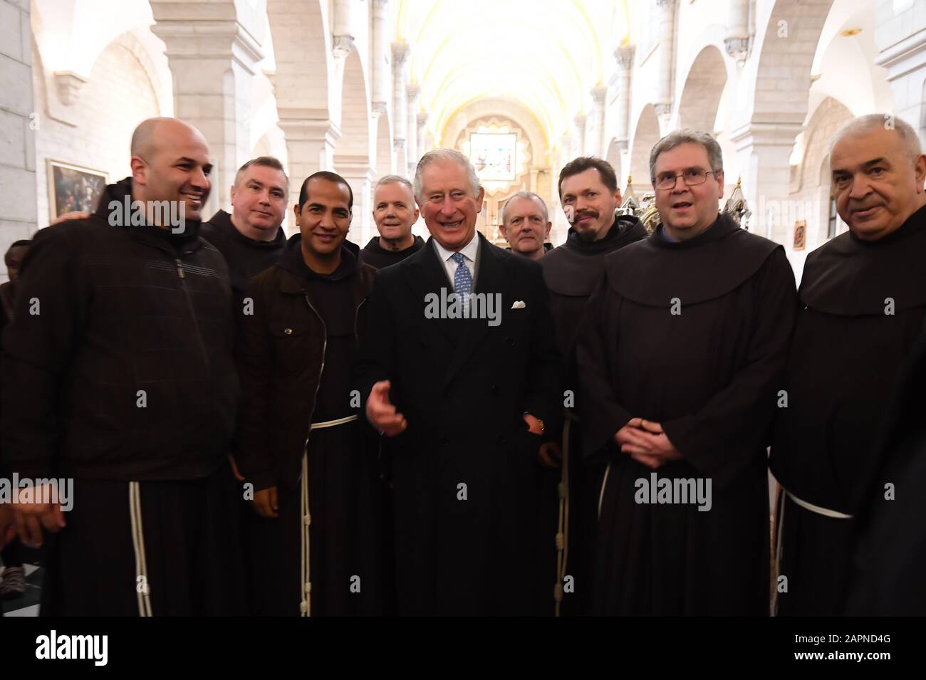 The Prince of Wales (centre) during a visit to the Church of the ...