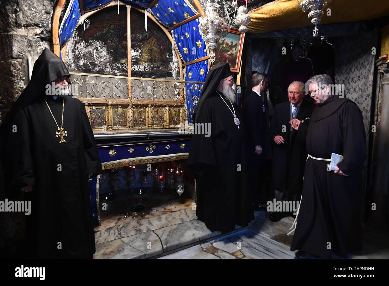 The Prince of Wales (second left) enters the crypt, which houses the ...