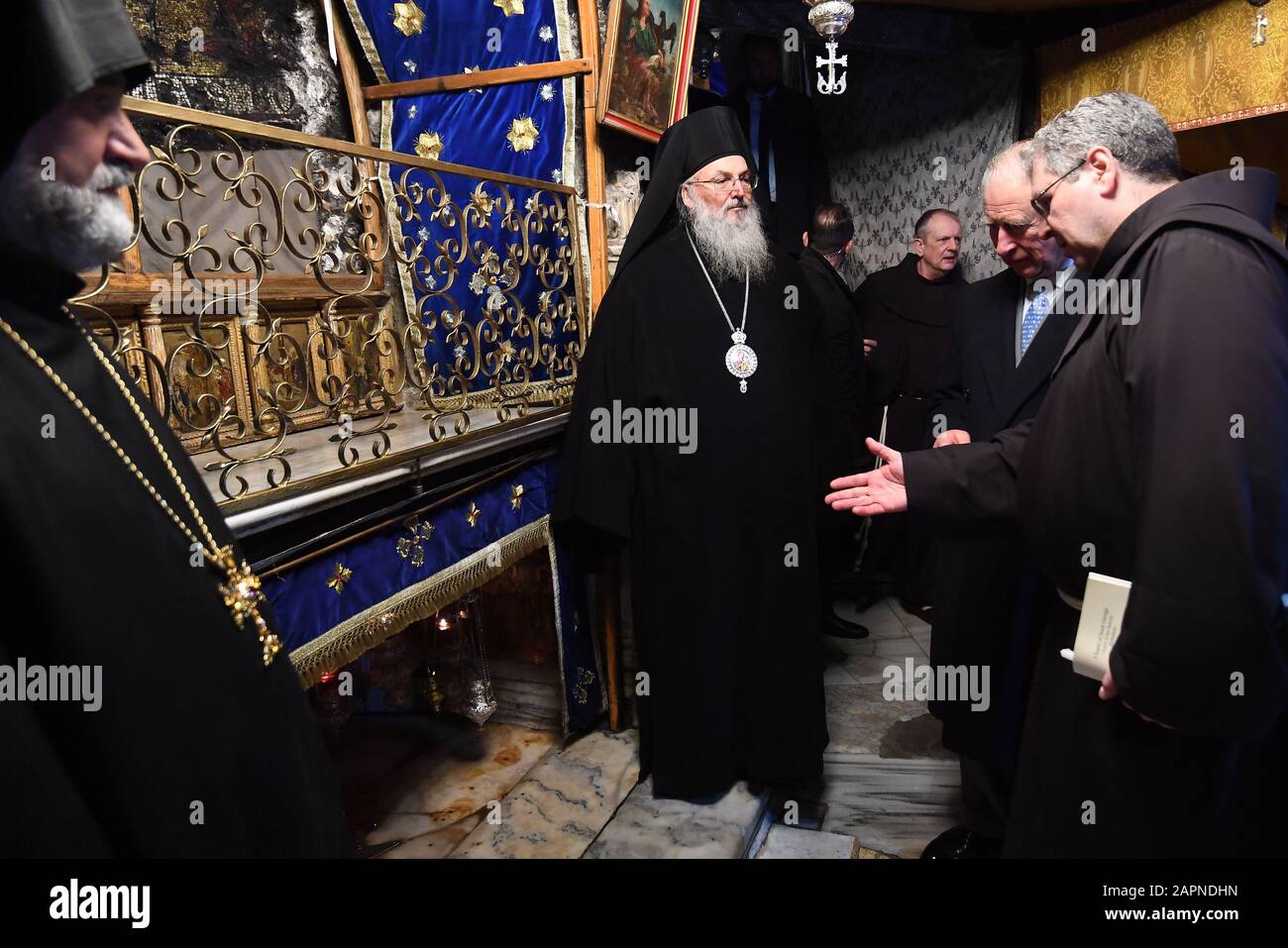 The Prince of Wales (second left) is shown the manger during a visit to ...