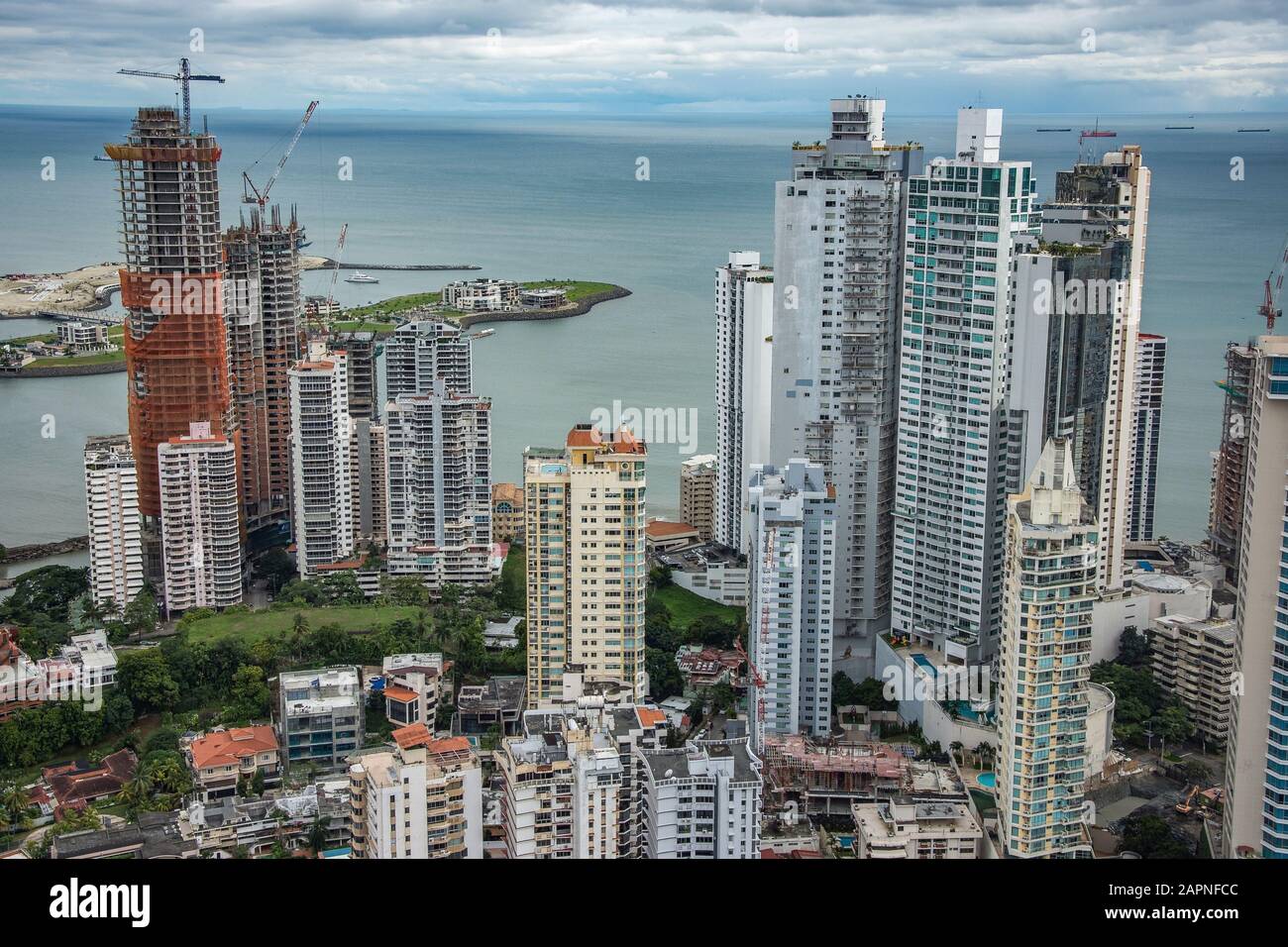 Construction of tall city buildings of Downtown Panama under a blue sky ...