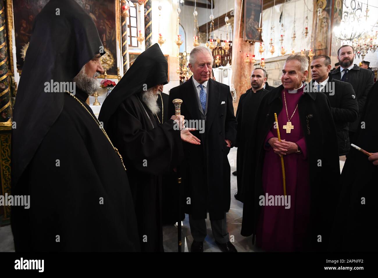 The Prince of Wales (centre) during a visit to the Church of the ...