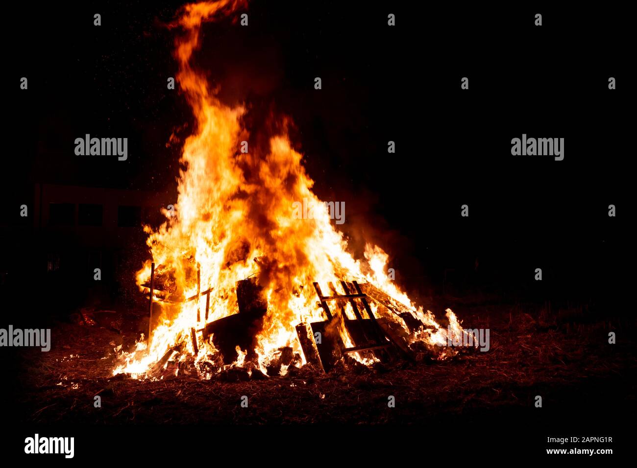 Large bonfire in the night. Fire flames on black background Stock Photo ...