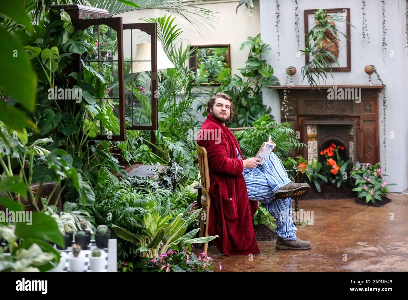 Staff member Callum Munro-Faure poses during a preview for the Giant ...