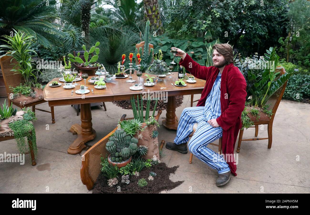 Staff member Callum Munro-Faure poses during a preview for the Giant ...