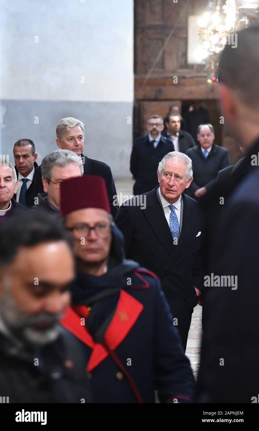 The Prince of Wales (centre) during a visit to the Church of the ...