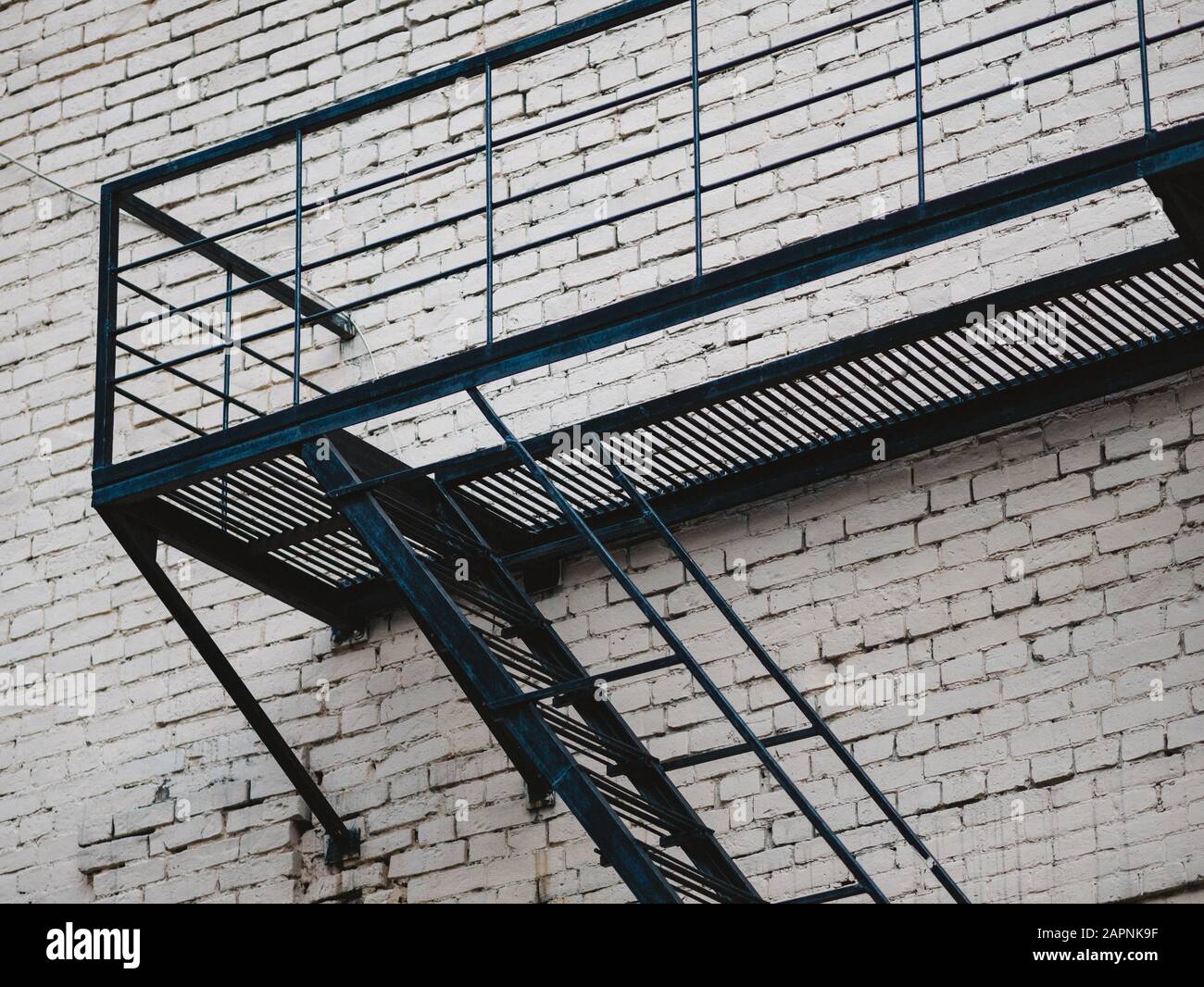 Facade with fire rescue steel ladder of old house in Moscow, Russia ...