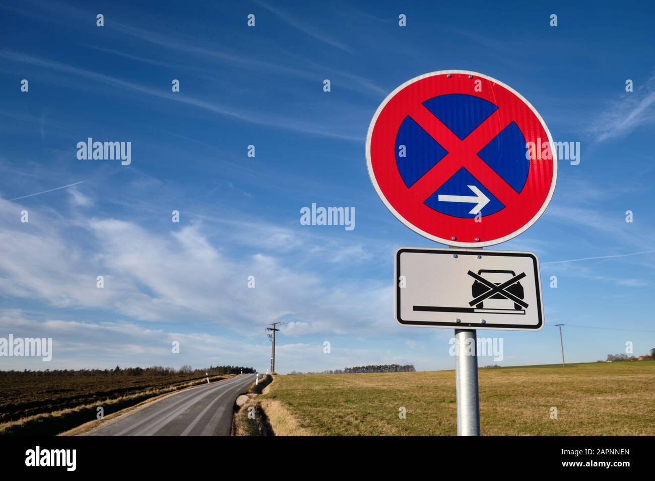 Red and blue traffic sign in front of beautiful blue sky and ...