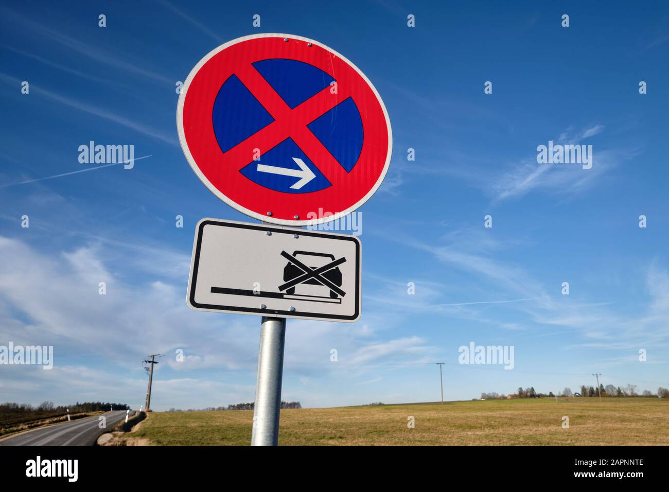 Red and blue traffic sign in front of beautiful blue sky and ...