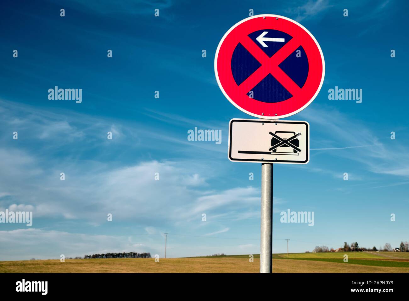 Red and blue traffic sign in front of beautiful blue sky and ...
