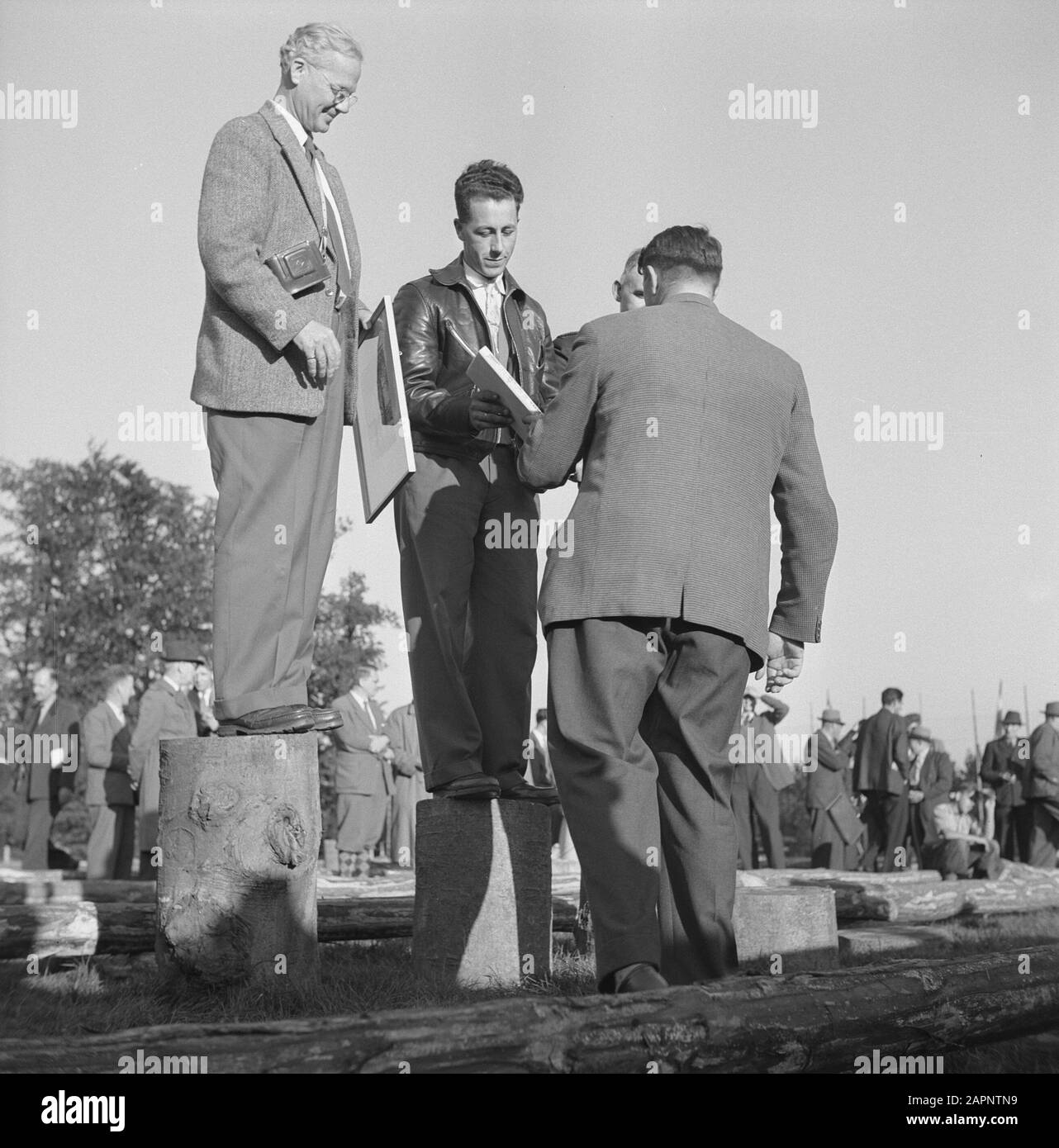 men, congratulations, spectators, trees Date: undated Keywords: trees ...