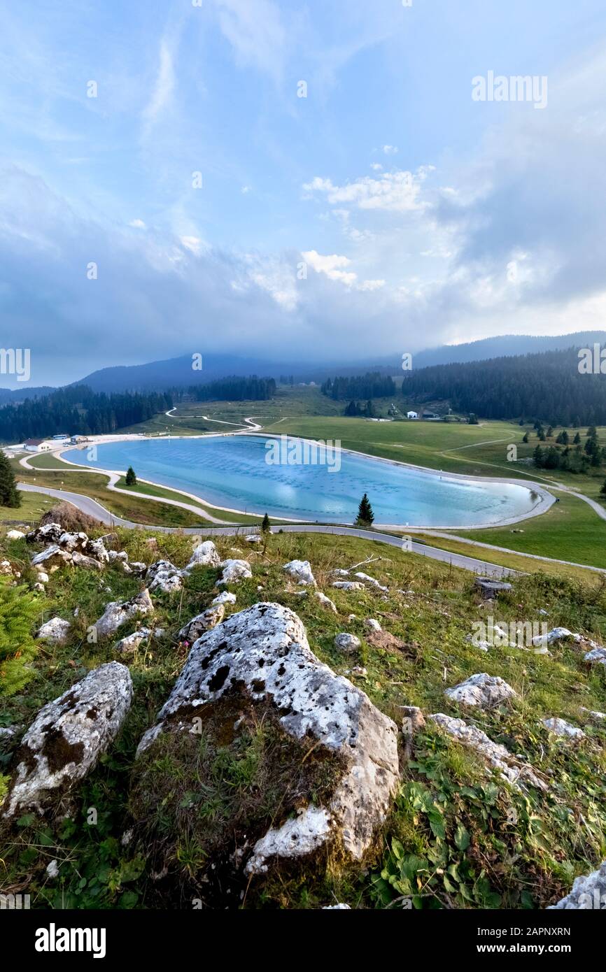 The lake and meadows at the Coe pass: Base Tuono museum on the right ...