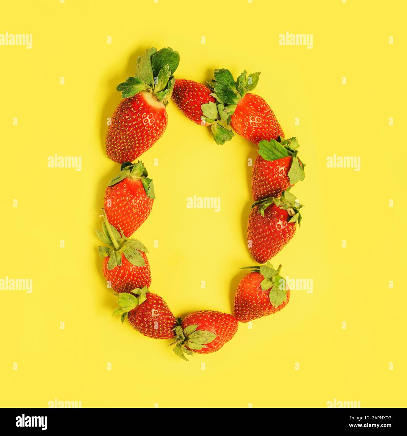Letter O made from Strawberries on a yellow background. Fruit alphabet ...