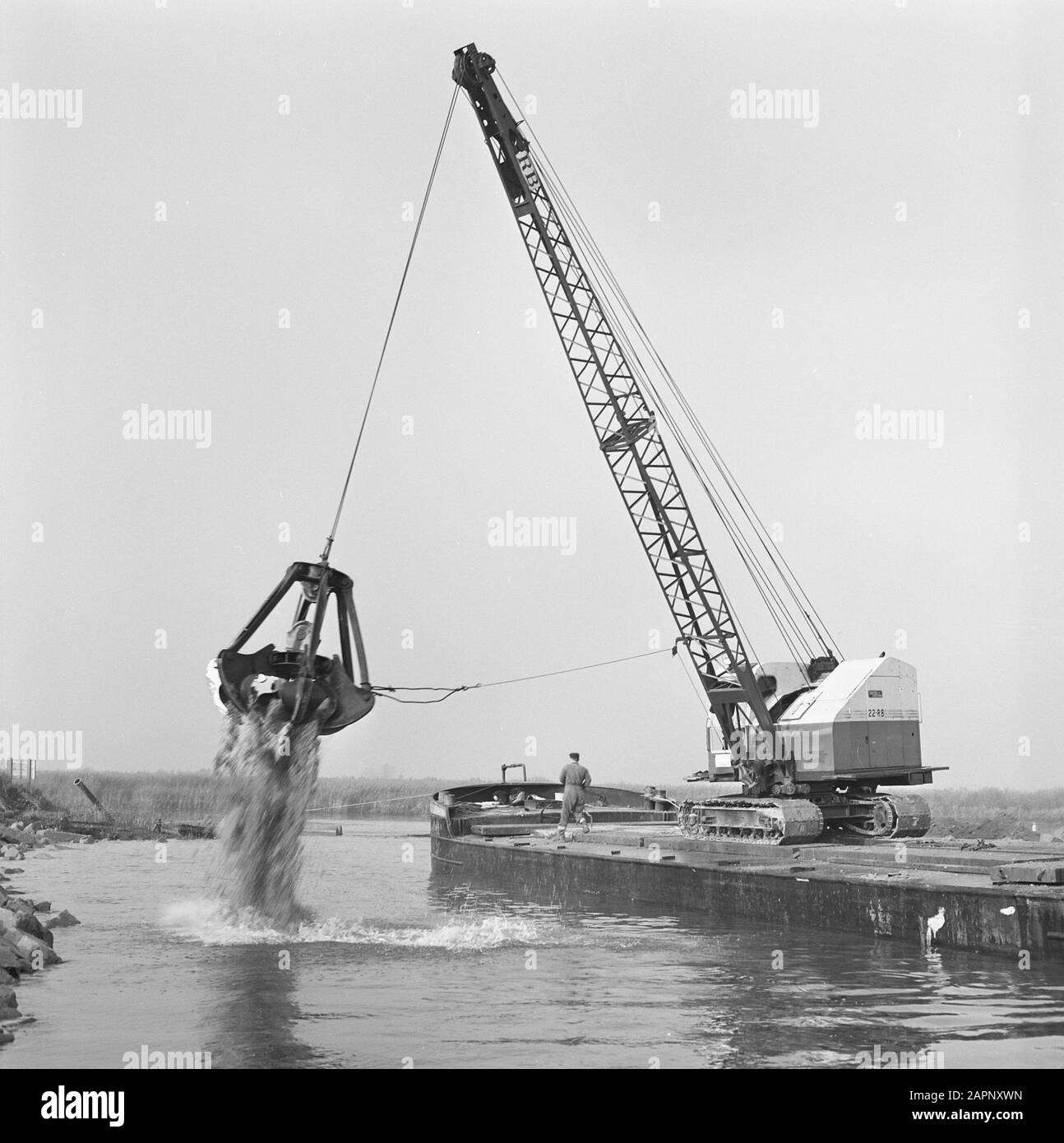 work, water, draglines, boulders, boats, workers Date: undated Location ...