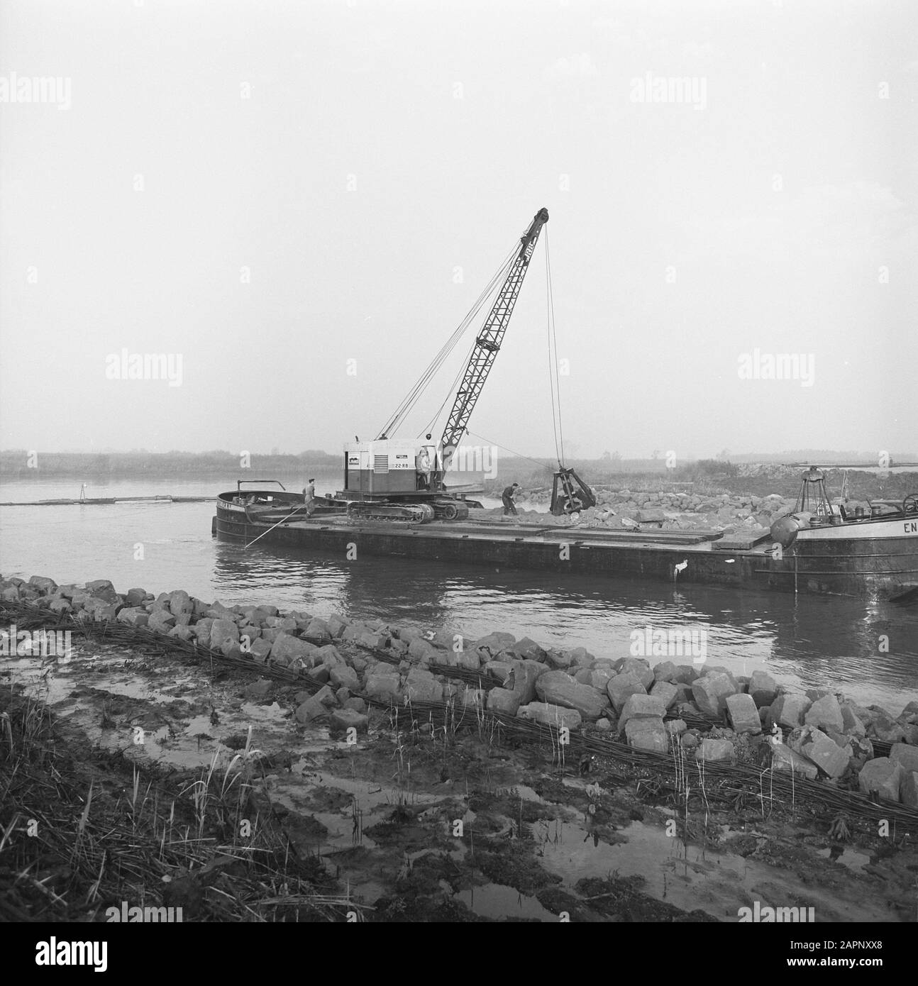 work, water, draglines, boulders, boats, workers Date: undated Location ...