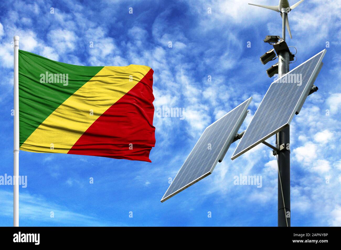 Solar panels on a background of blue sky with a flagpole and the flag ...