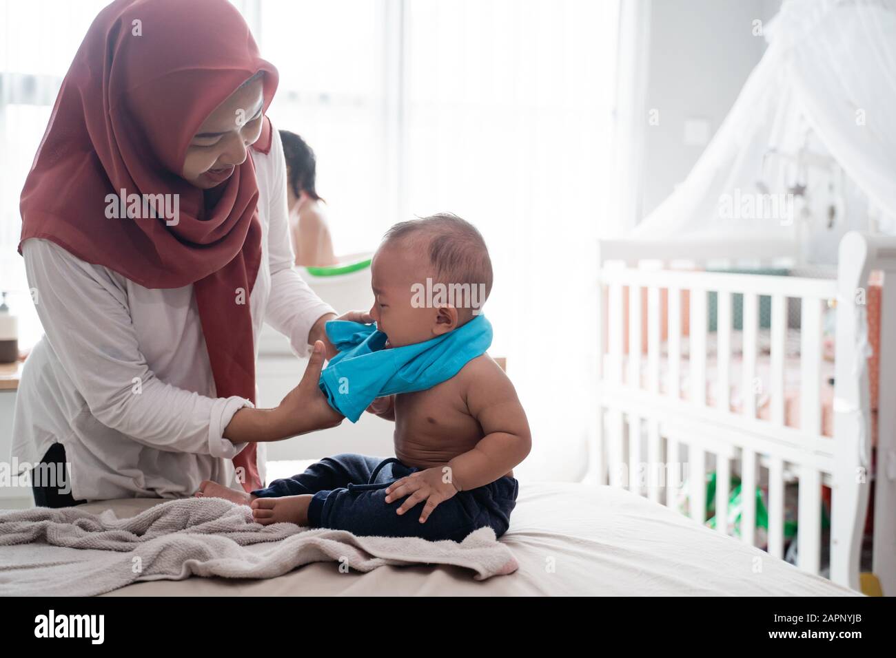 Baby mother change clothes diaper hi-res stock photography and images ...