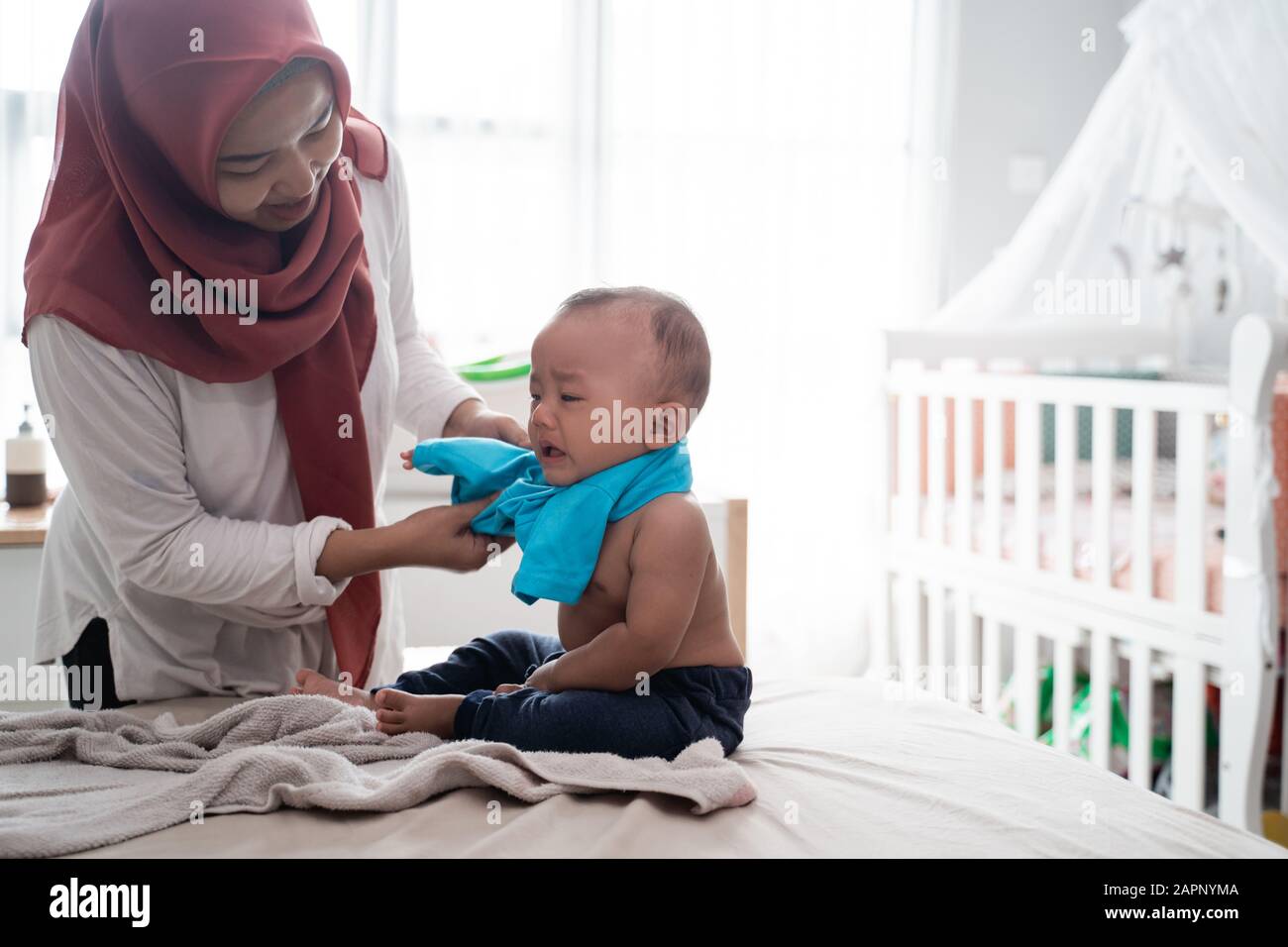 Baby mother change clothes diaper hi-res stock photography and images ...