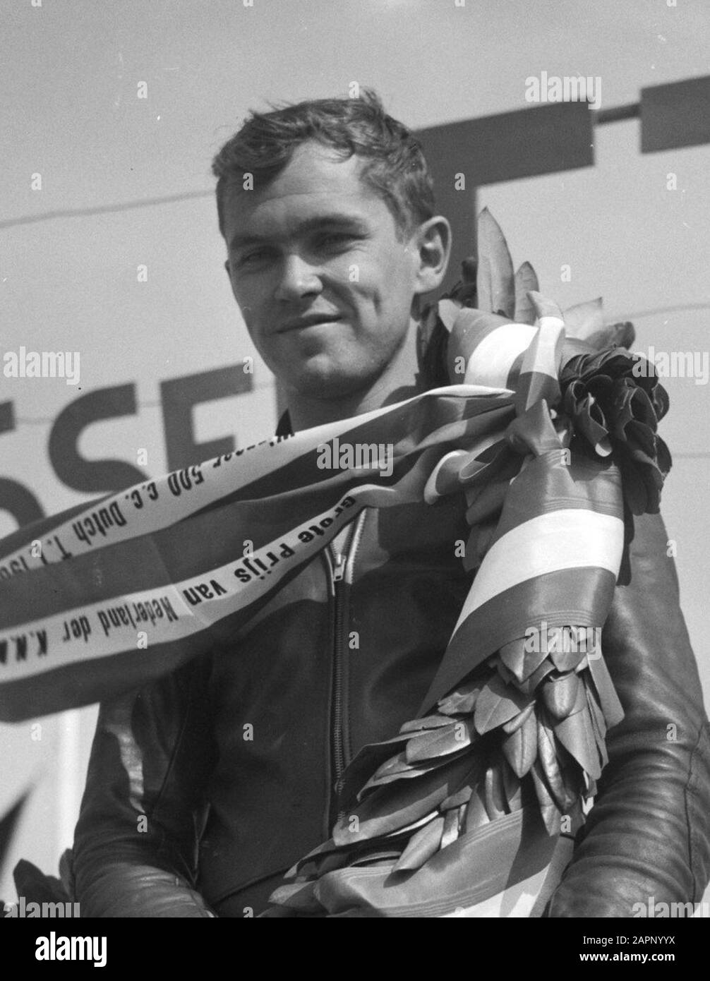 Award Gary Hocking (Rhodesia) winner 500cc race with flowers, TT Assen ...