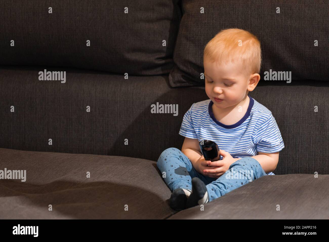 Little boy watching tv Stock Photo - Alamy