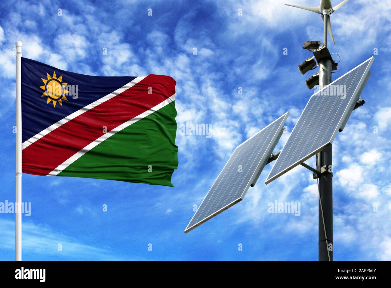 Solar panels on a background of blue sky with a flagpole and the flag ...