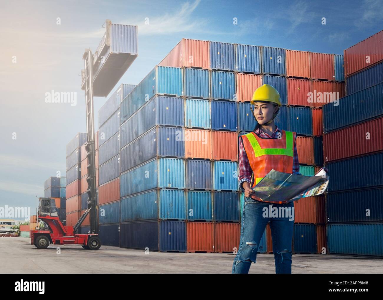 Women woker control loading Containers box from Cargo freight ship ...