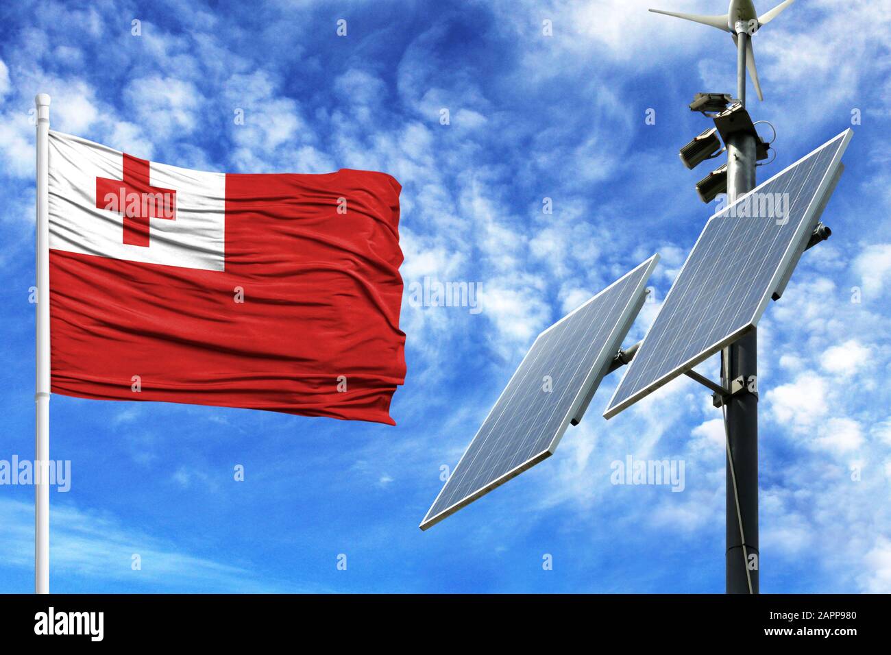 Solar panels on a background of blue sky with a flagpole and the flag ...