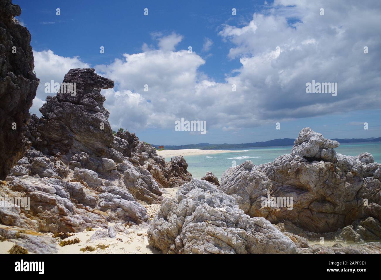 Large - eroded by water - rocks on a beach of a small island in the ...