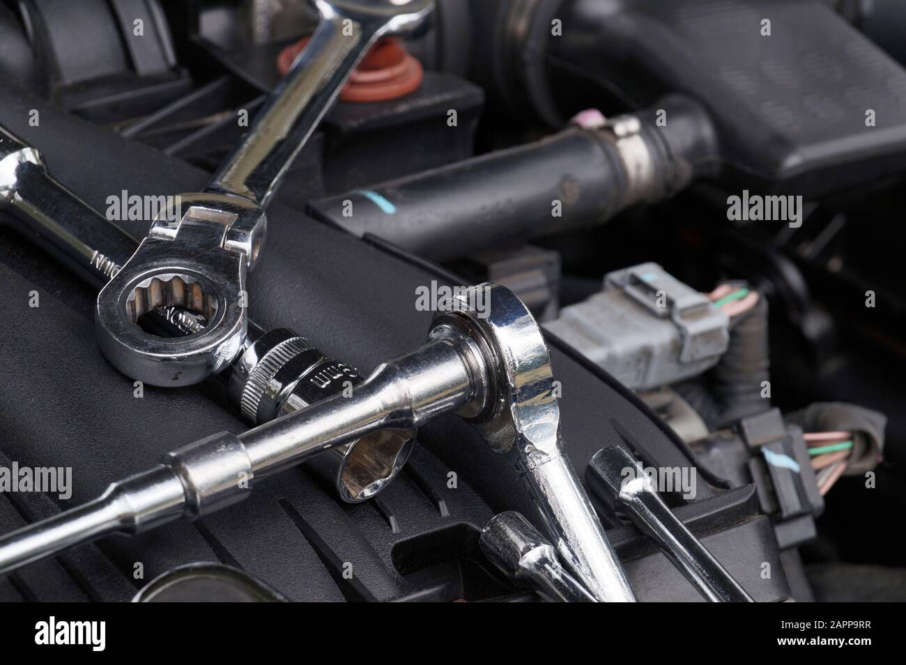 Wrenches for repair lying in the engine compartment. Car repair ...