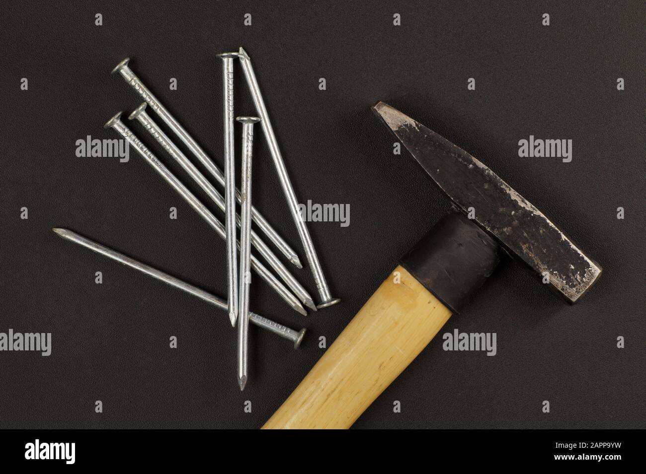 Hammer and nails. The simplest tools Stock Photo - Alamy