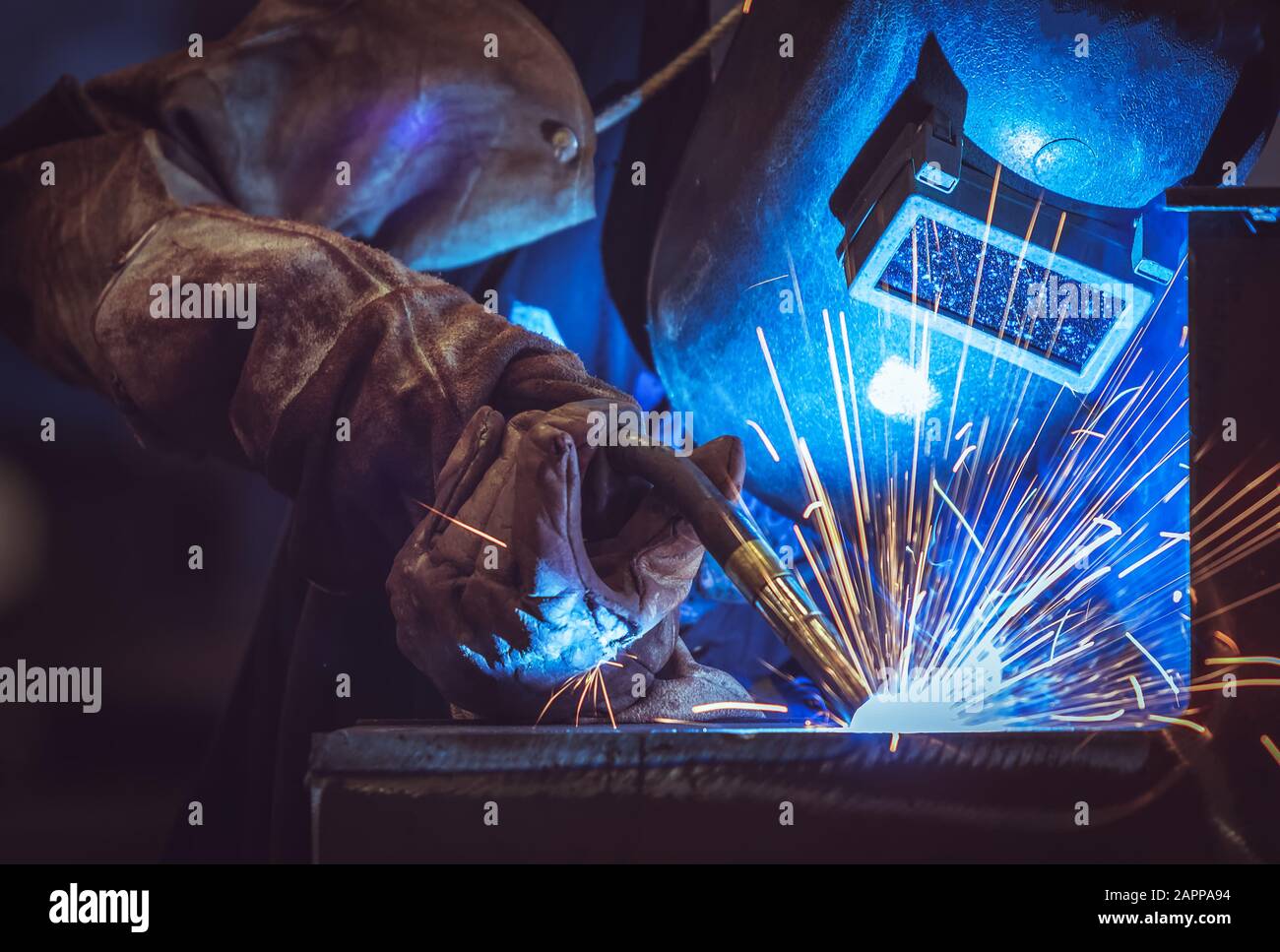 Industrial Worker at the factory welding steel structure Stock Photo ...