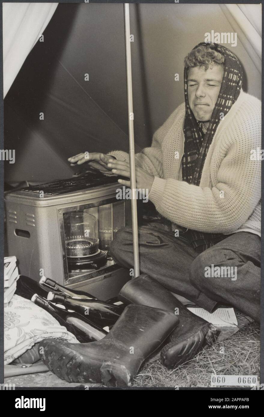 Tourists try to enjoy themselves in the rain during the bad summer of ...