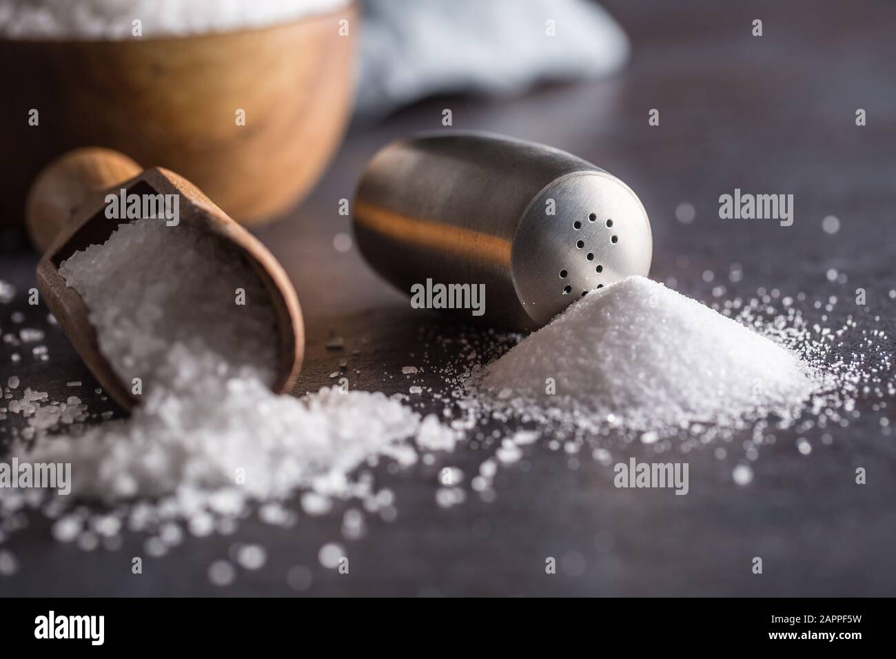 Sea and kitchen mineral salt spoon and shaker Stock Photo - Alamy