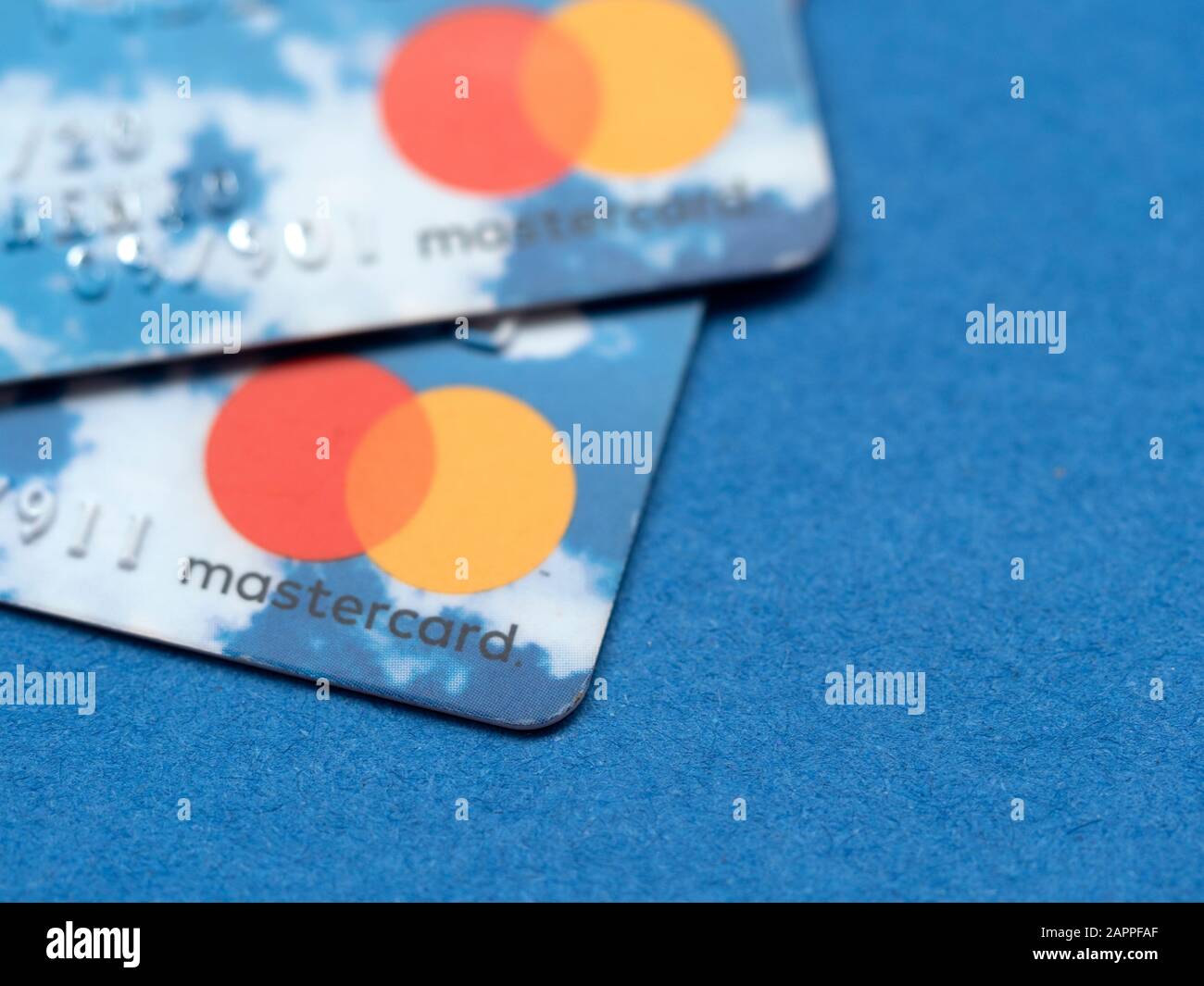 Mastercard bank cards on a dark blue background Stock Photo - Alamy