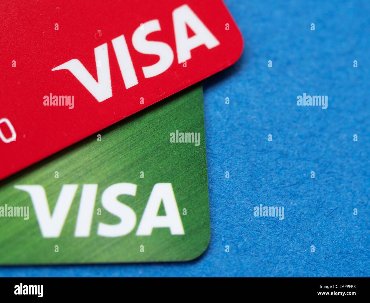 Visa bank cards on a dark blue background Stock Photo - Alamy