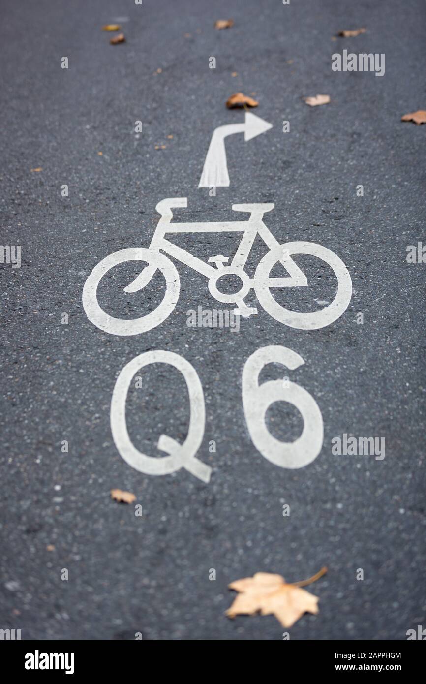 A painted sign for a cycle path on the road Stock Photo - Alamy