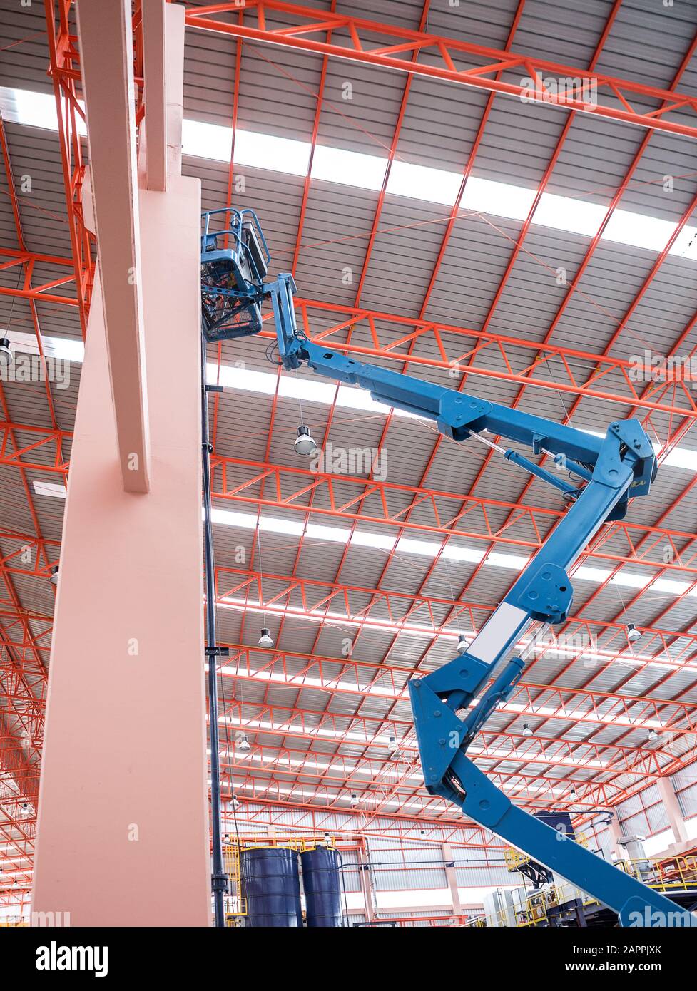 Self propelled scissor lift for maintenance factory Stock Photo - Alamy