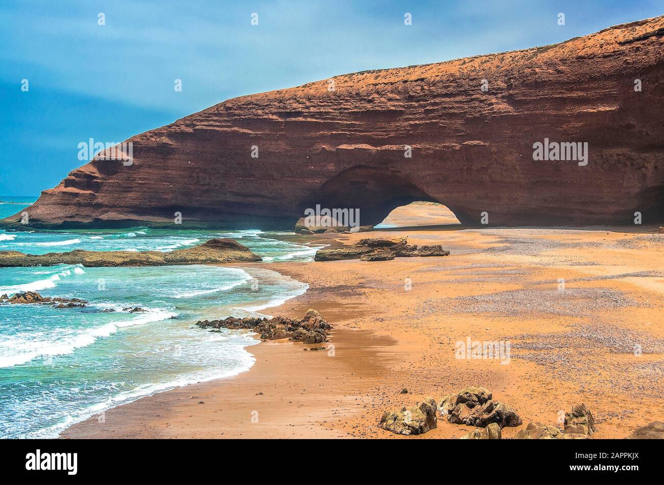 Legzira dramatic natural stone arches reaching over the sea, Atlantic ...