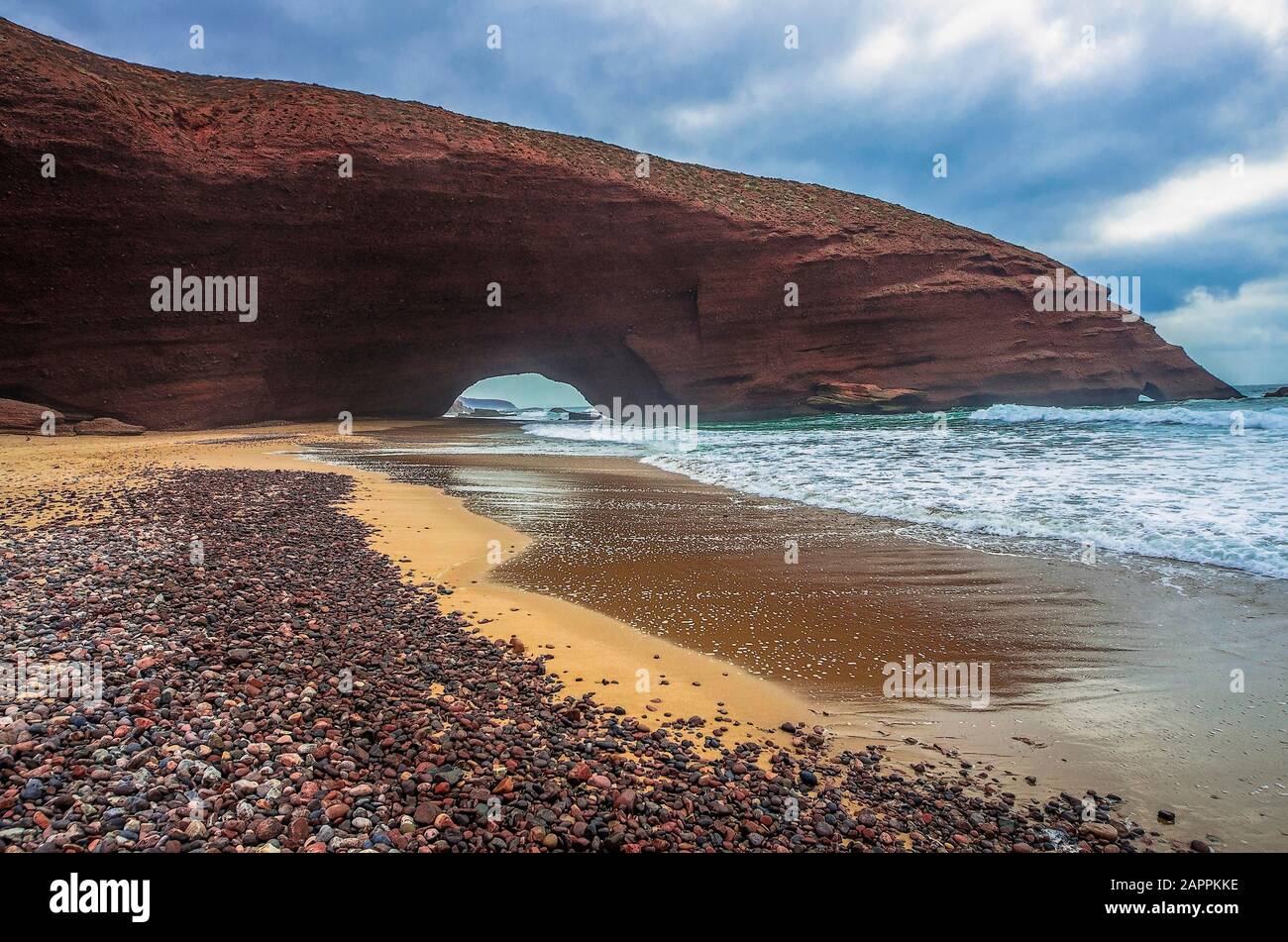Legzira dramatic natural stone arches reaching over the sea, Atlantic ...