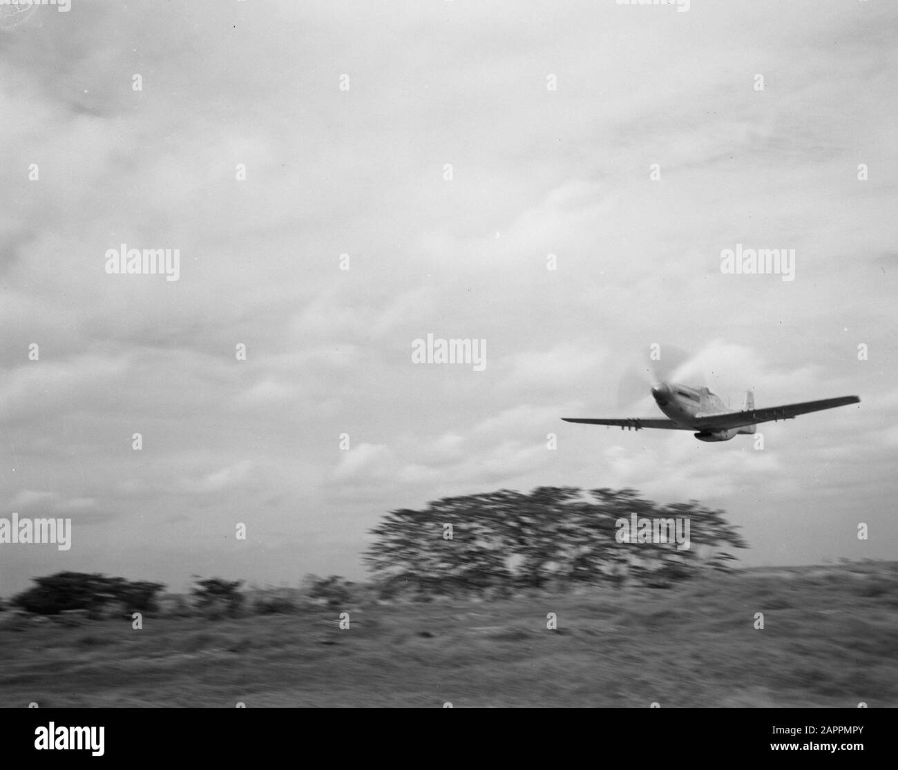 [Hunting plane low over airport] Date: 1947/01/01 Location: Indonesia ...
