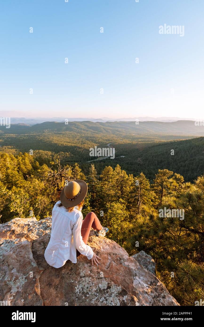 Woman enjoying sunset, Payson, Mogollon Rim, Arizona, United States ...