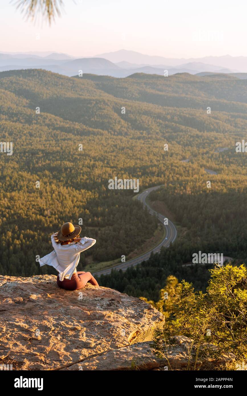 Woman enjoying sunset, Payson, Mogollon Rim, Arizona, United States ...
