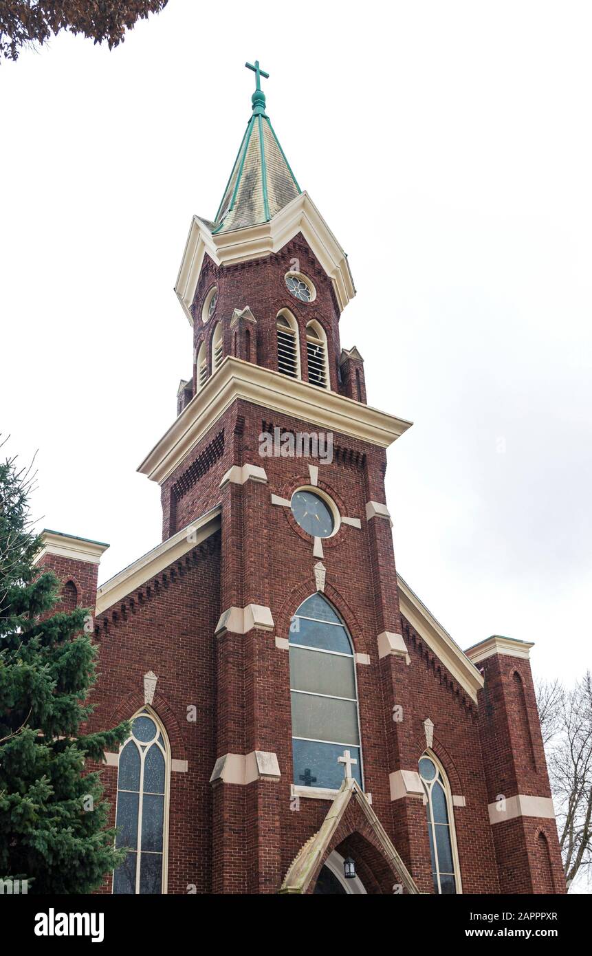 landmark catholic church steeple and brick facade of gothic revival ...