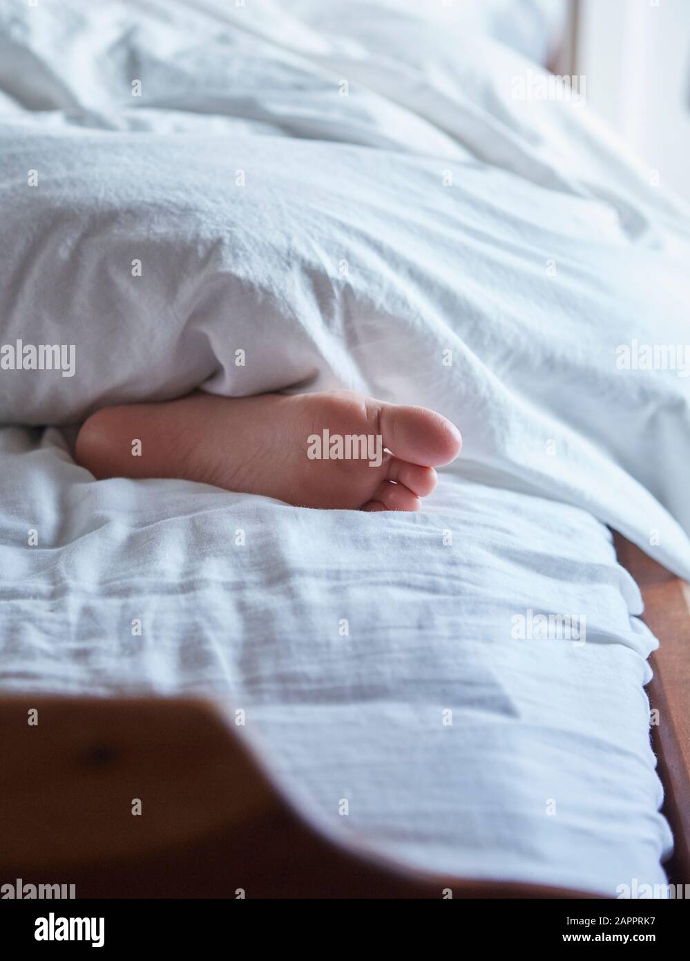 Foot under duvet in bed hi-res stock photography and images - Alamy