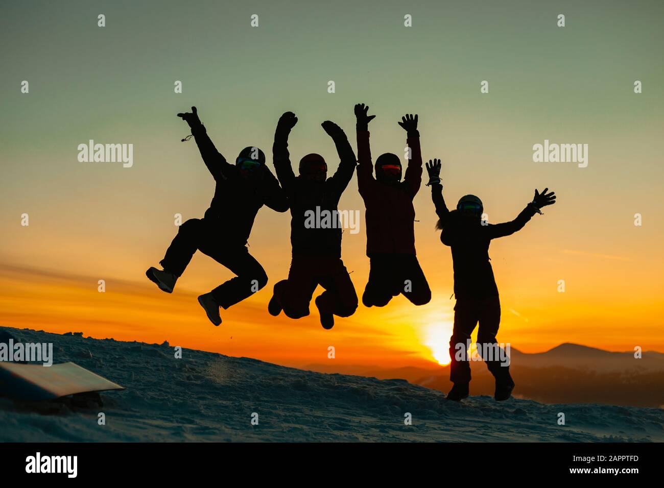 Silhouette friends arms raised sunset hi-res stock photography and ...