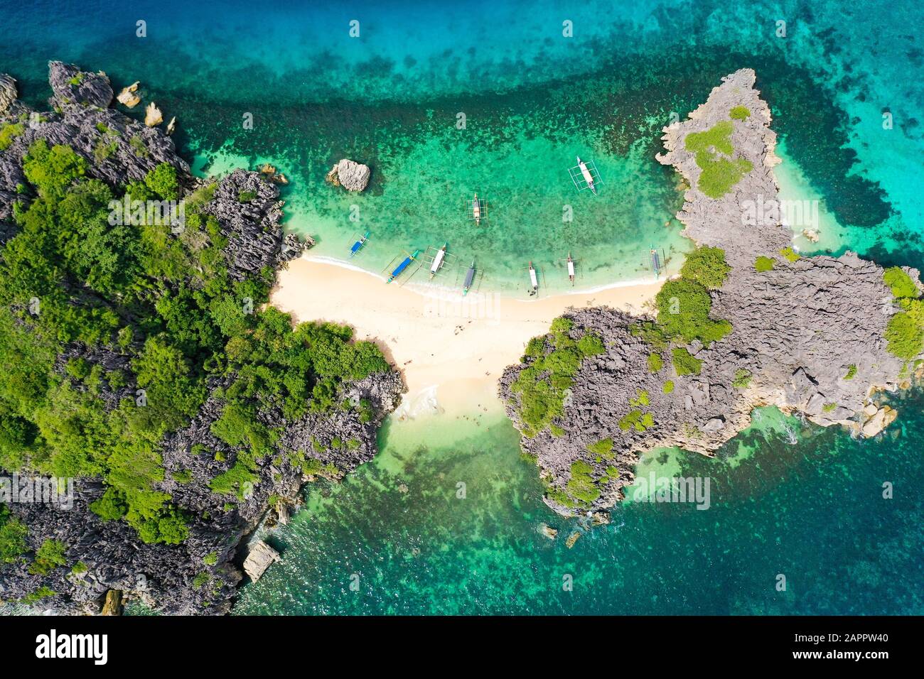 Top view of small tropical island with white sandy beach and blue ...