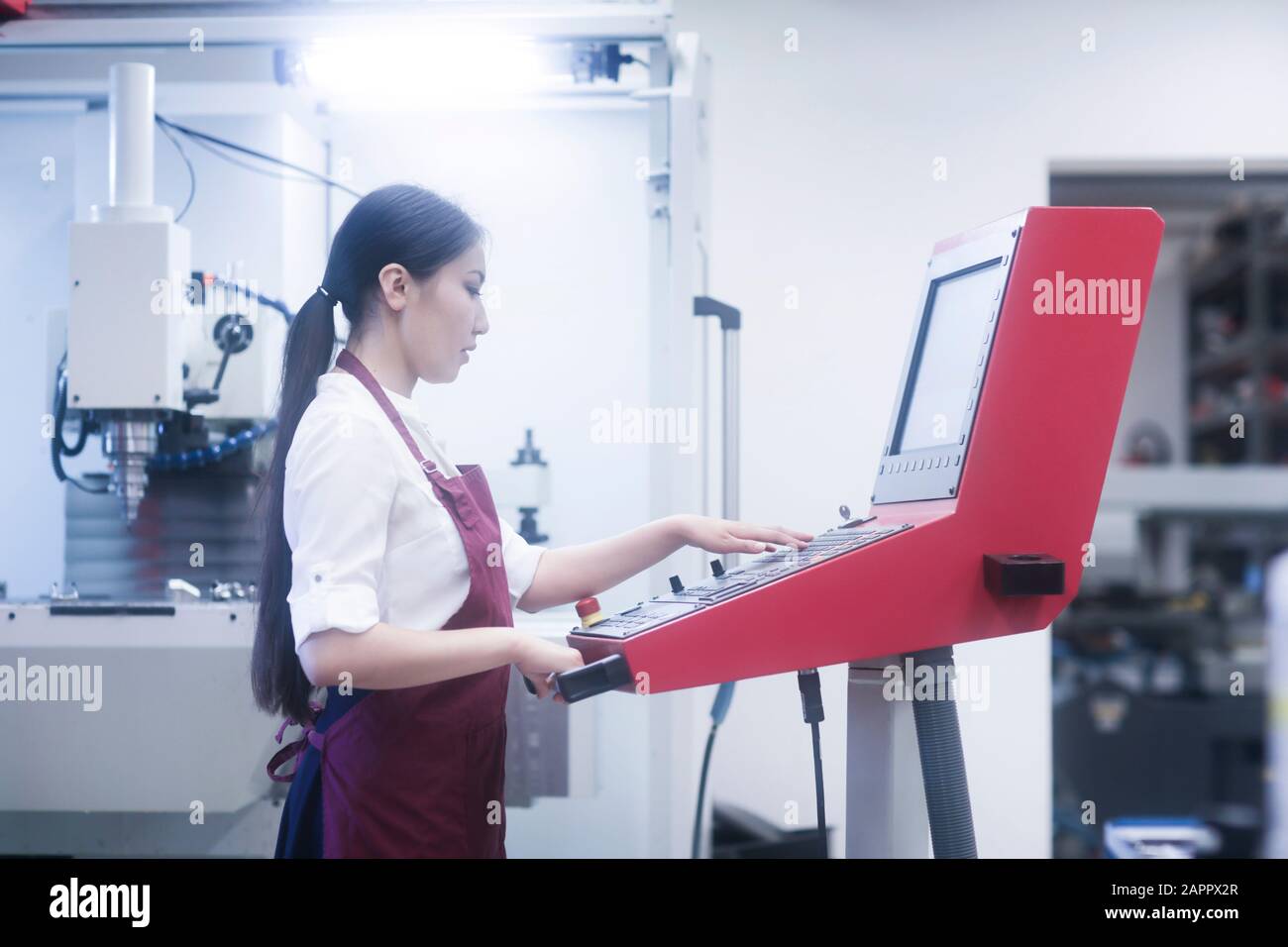 Woman wearing laboratory apron hi-res stock photography and images - Alamy